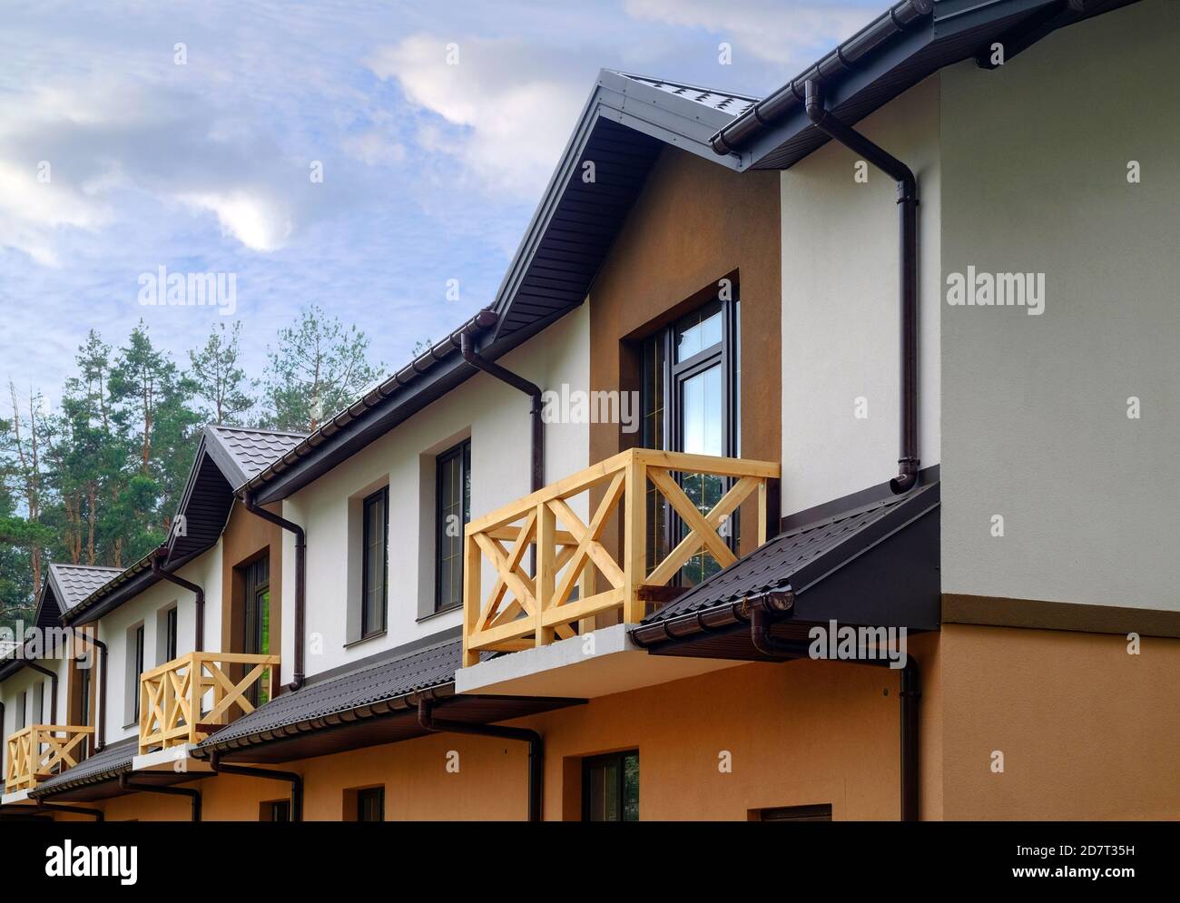 New cottage house with metal roof, rain gutter and balcony Stock Photo ...