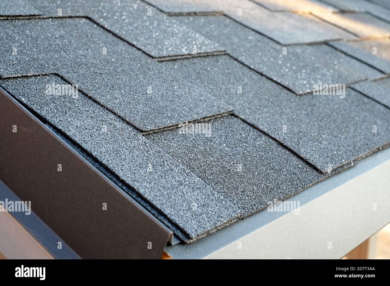 Close up view on corner roof made is asphalt roofing shingles Stock ...