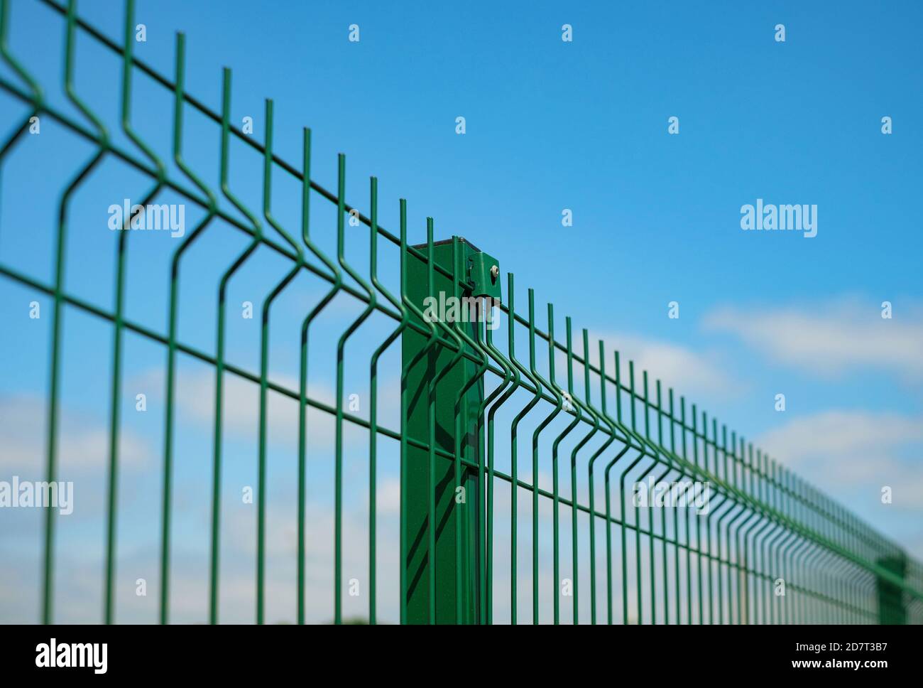 Steel grating fence made with wire on blue sky background. Sectional ...