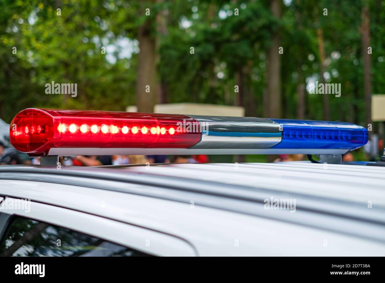 Patrol police car with red and blue lights on the street. Patrolling ...