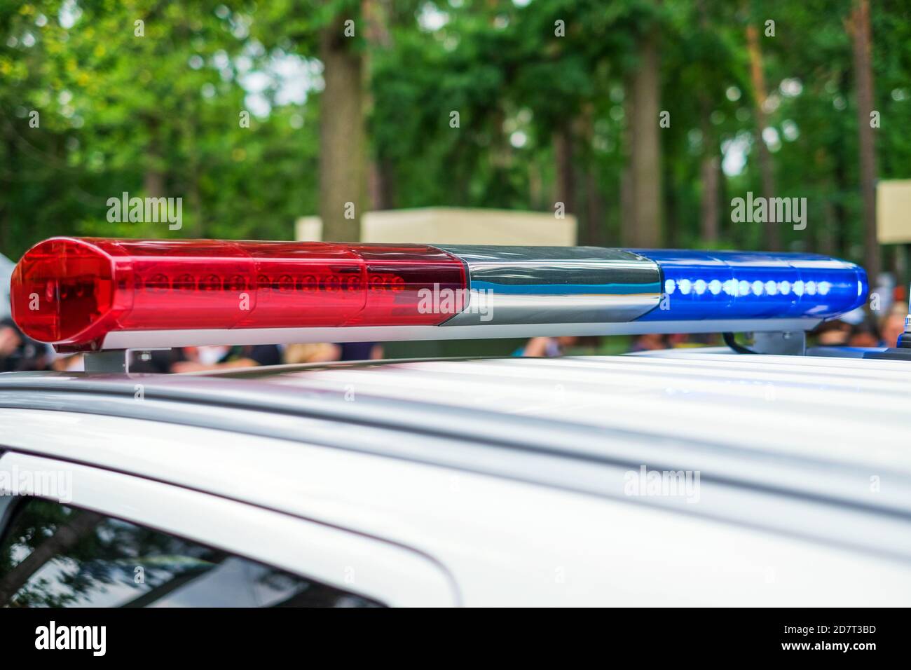 Patrol police car with red and blue lights on the street. Patrolling ...
