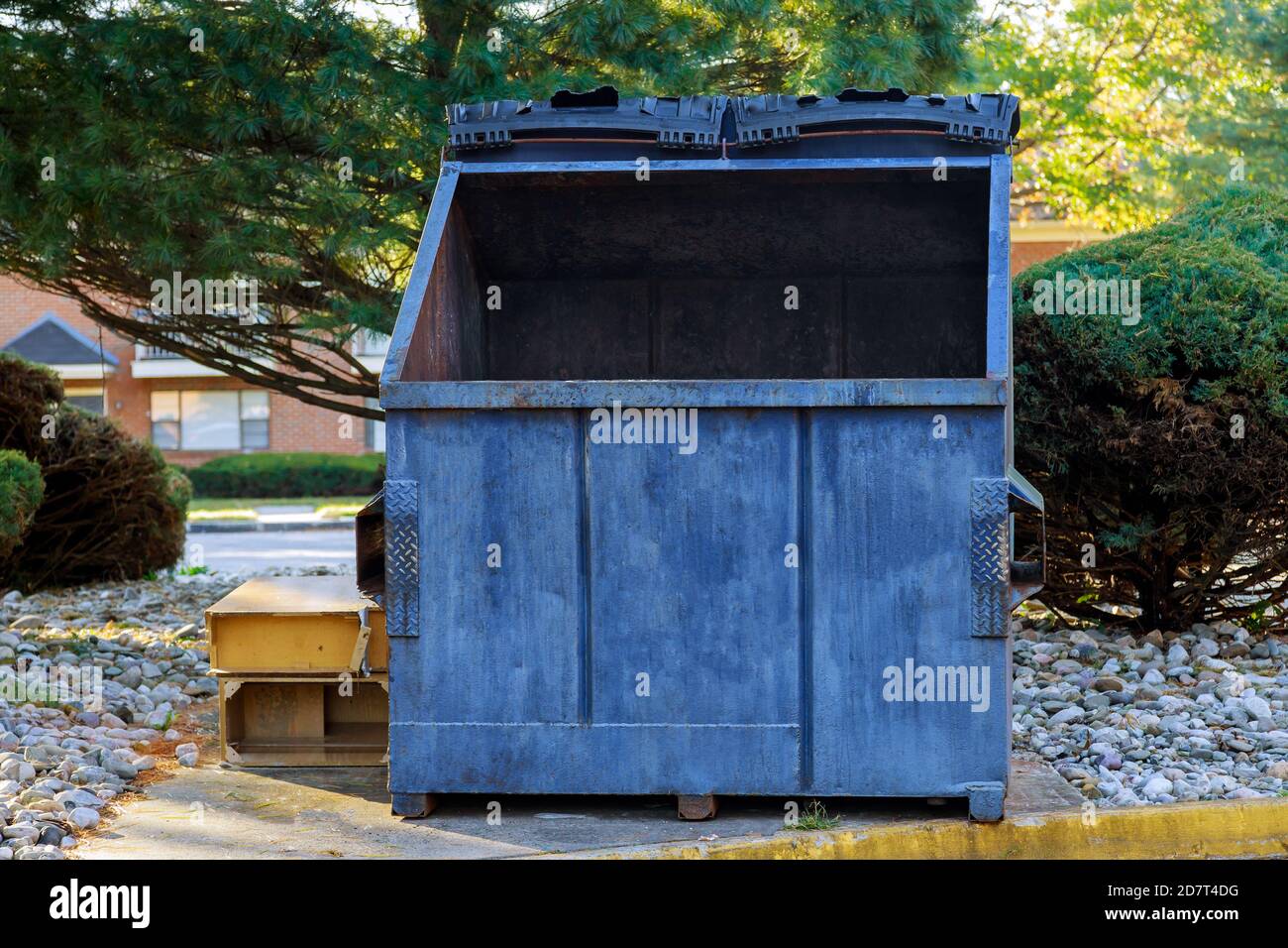 Garbage containers of cans near residential buildings in ecology ...