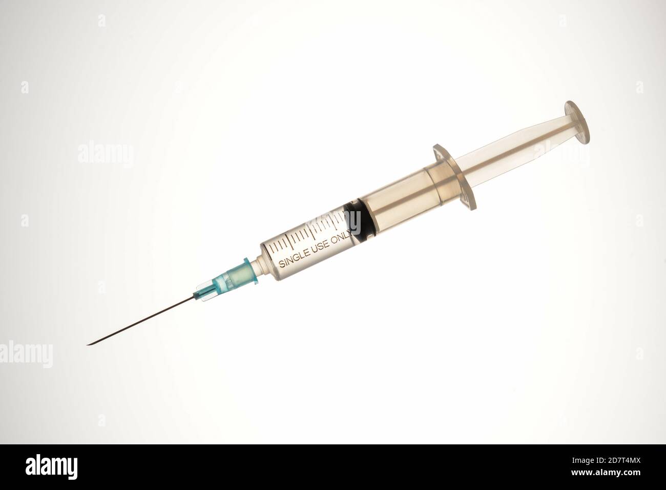 Syringe with medicinal solution, on light background with reflection. 2 ...