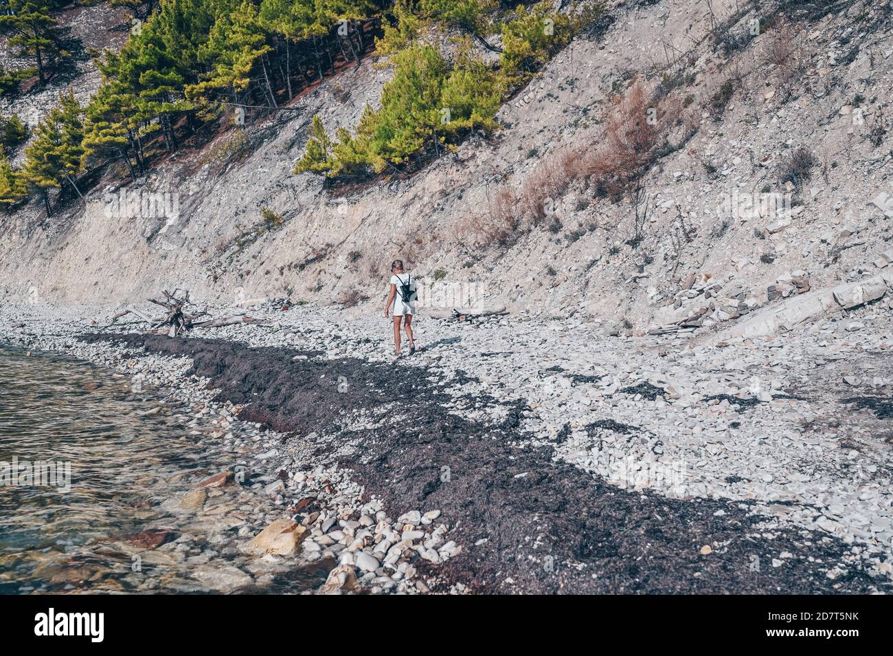 Elderly senior traveling backpacker mature woman tourist walking taking ...