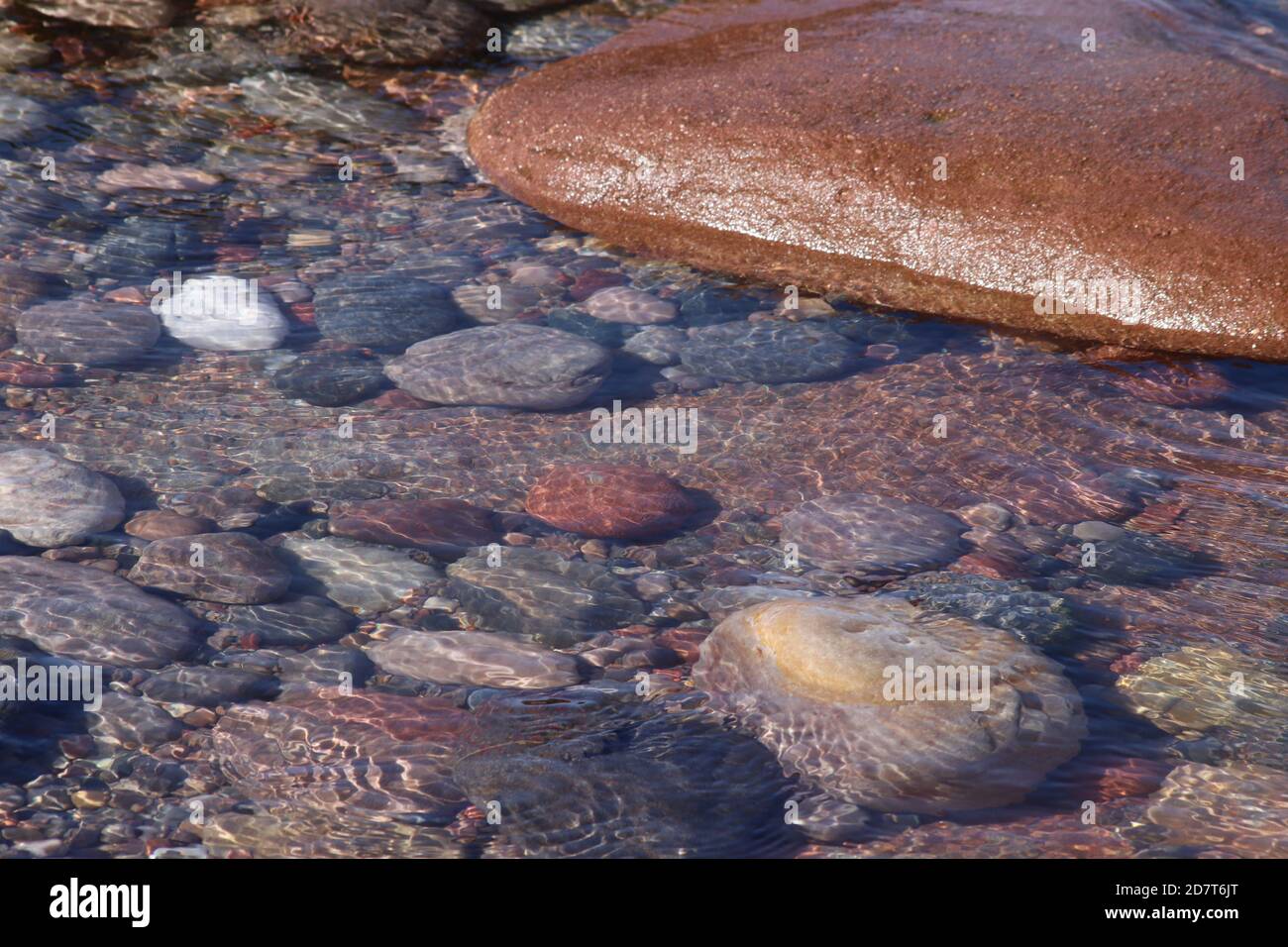 Pebbles under water Stock Photo - Alamy