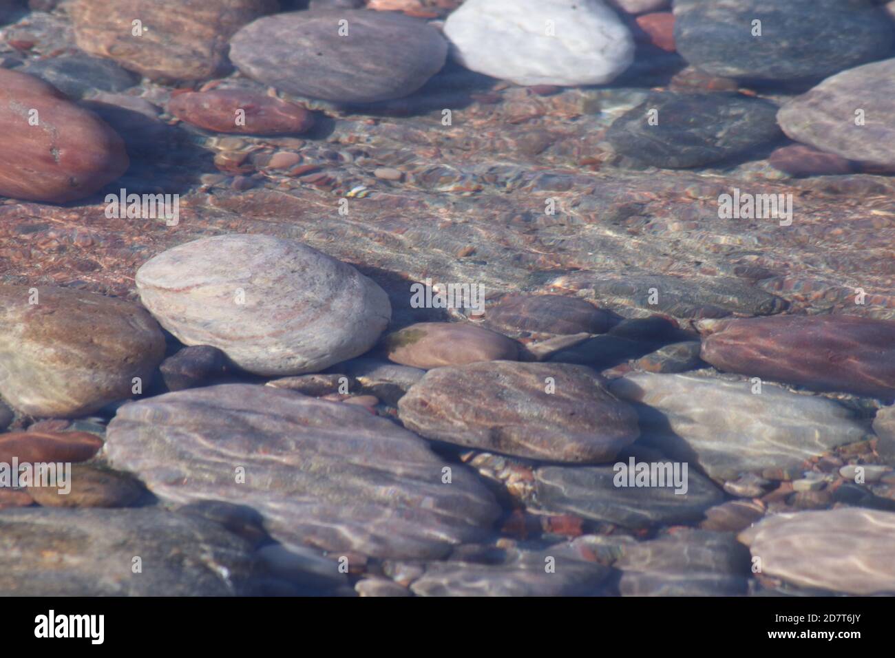 Pebbles under water Stock Photo - Alamy