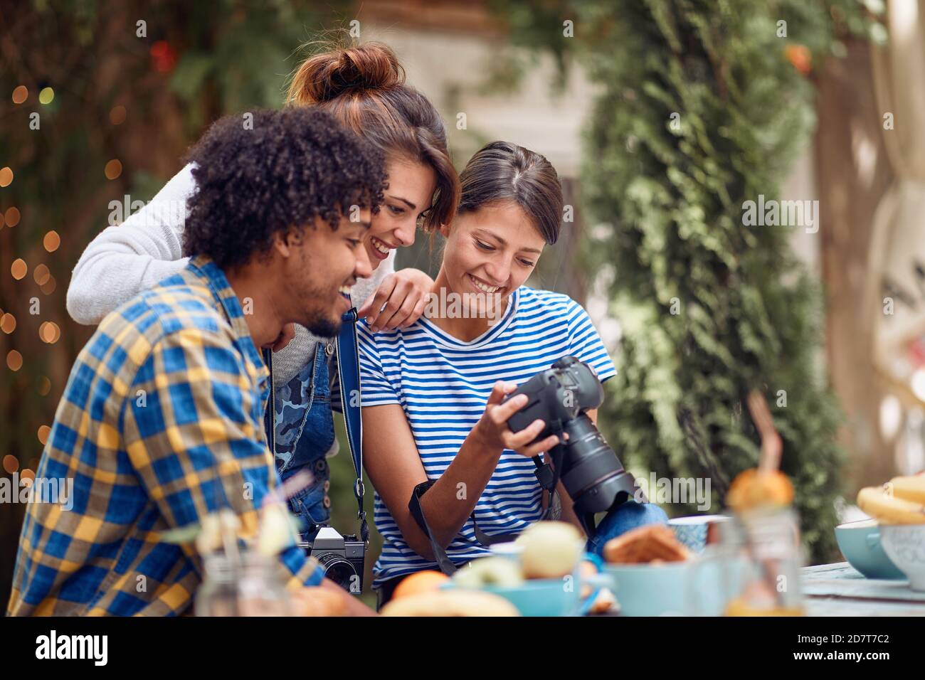 Friends enjoying camera photos at the bar's backyard. Quality ...