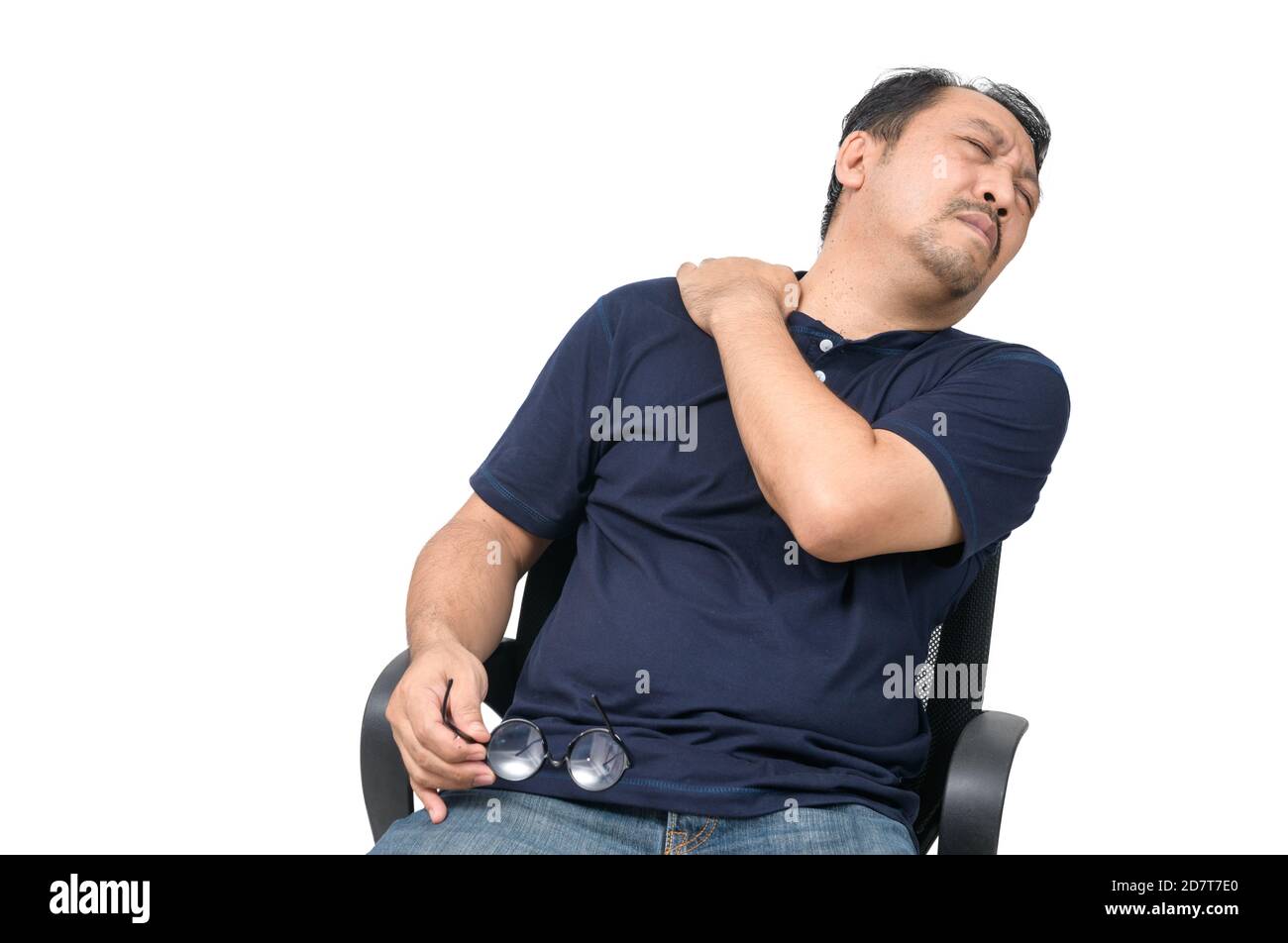 Asian man sit on chair and suffering from neck or shoulder pain ...