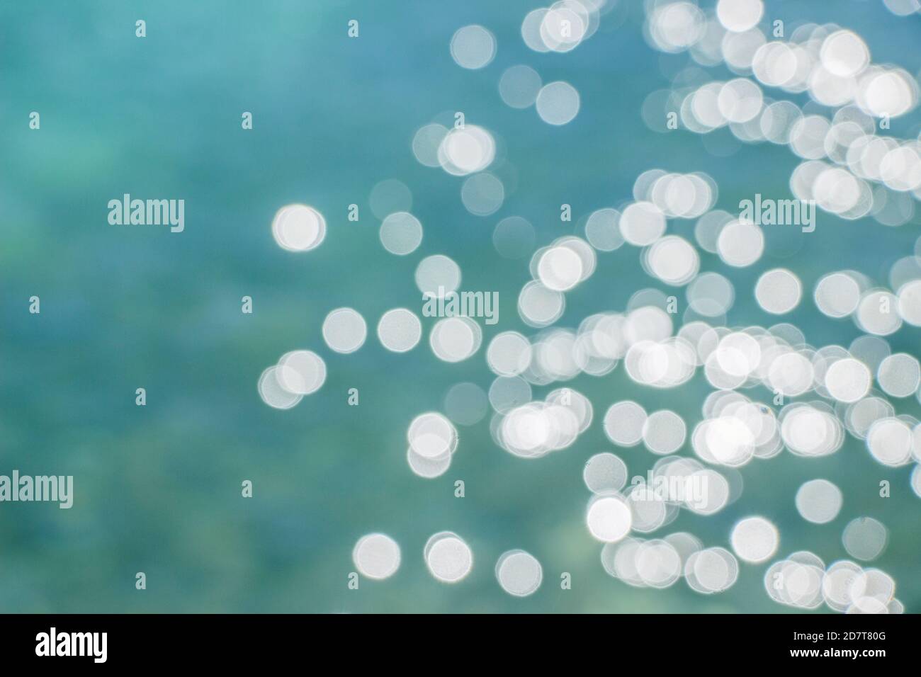 blurry sunlight spots on blue ocean surface Stock Photo - Alamy