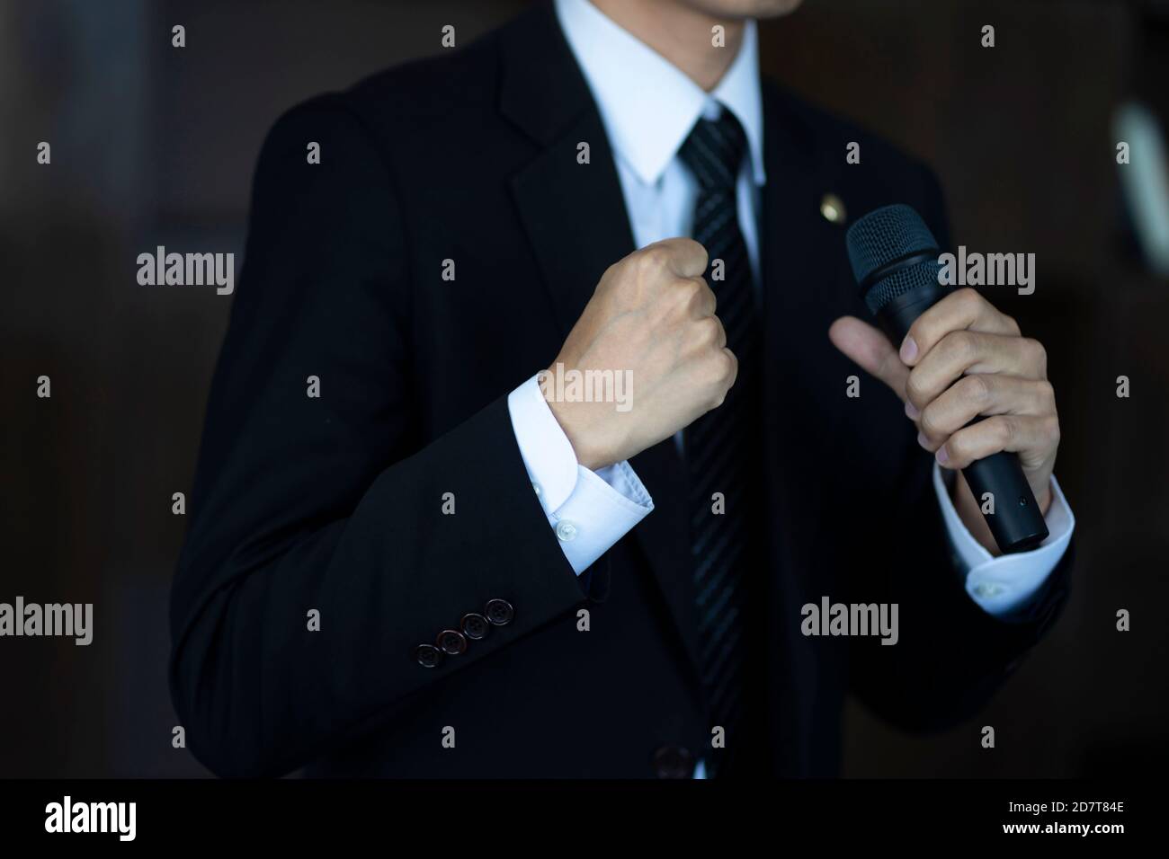 Close up of businessman speaking with microphone Stock Photo - Alamy