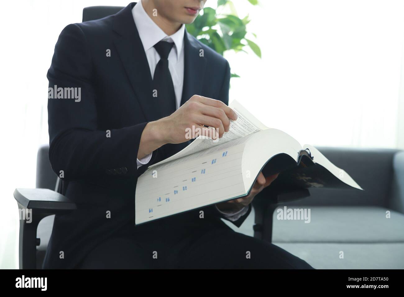 Lawyer reading law book in office Stock Photo - Alamy