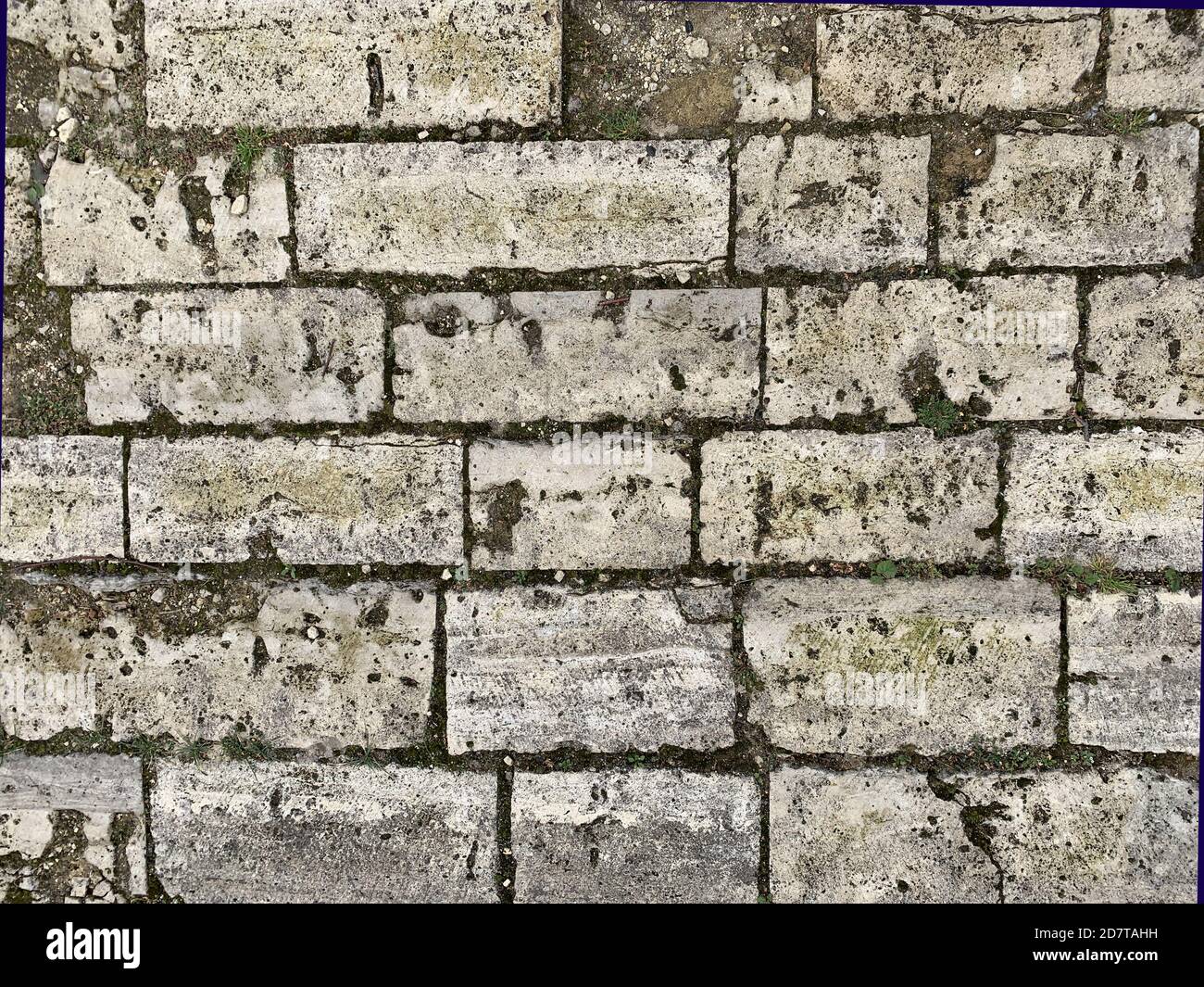 Old grey bricks background. Ancient wall Stock Photo - Alamy