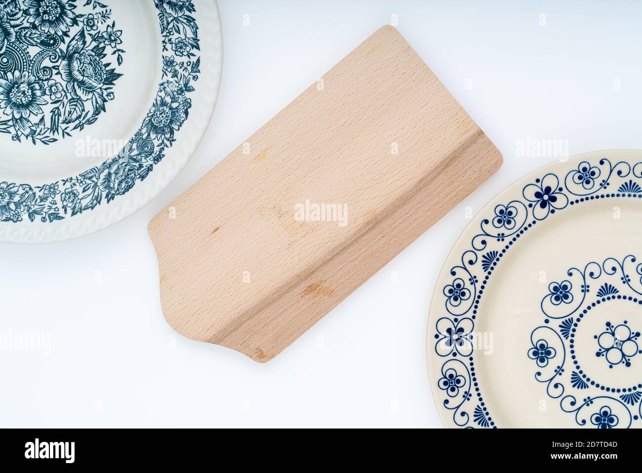cutting board and ceramic plates on white background flat lay Stock ...