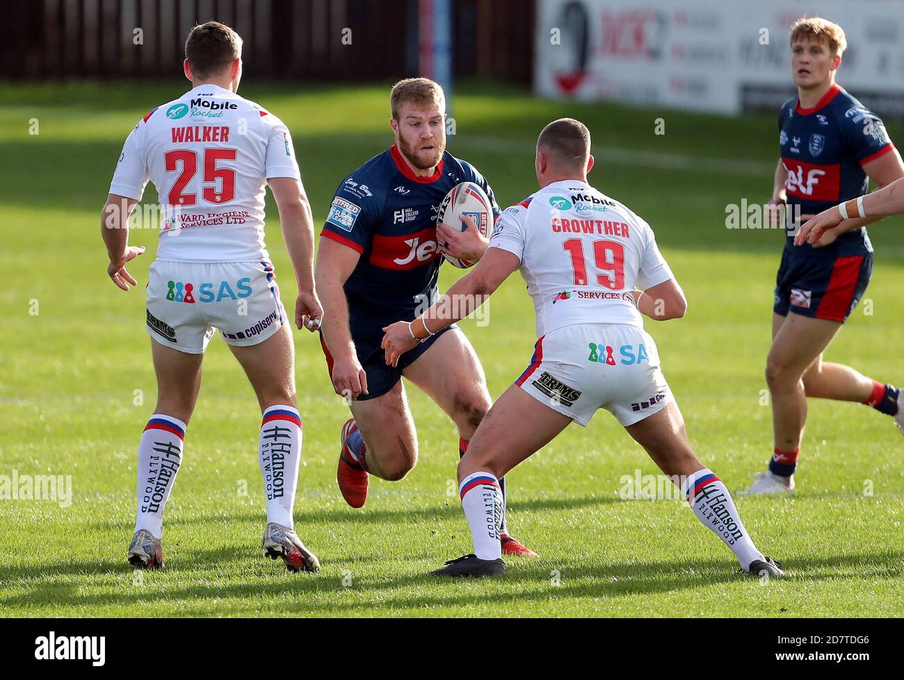 Hull Kr's Daniel Murray runs at Wakefield Trinity's Brad Walker and ...