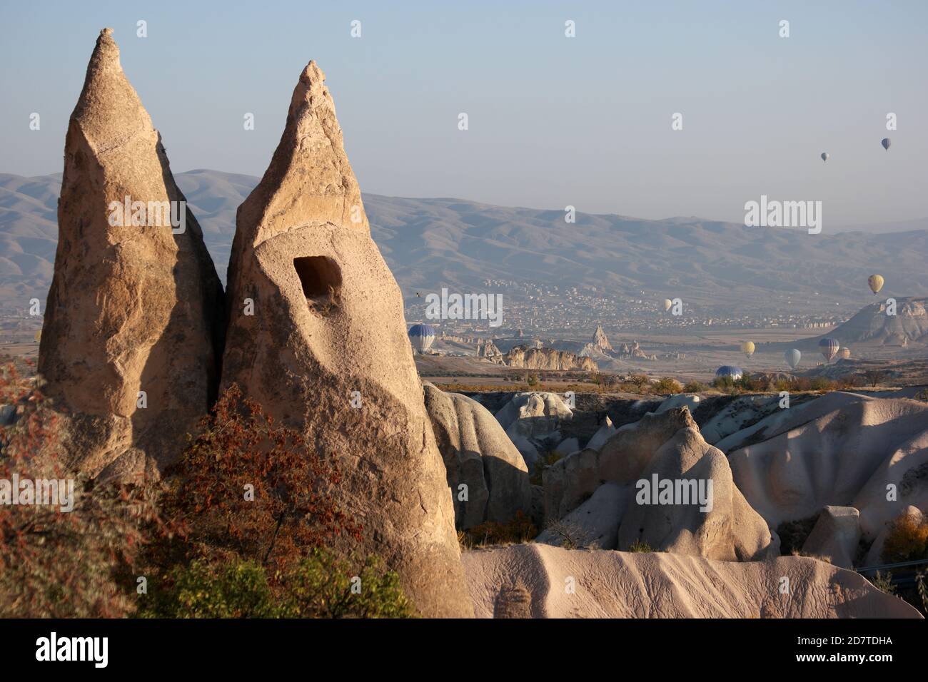 Big stone formations with flying hot air balloons Stock Photo - Alamy