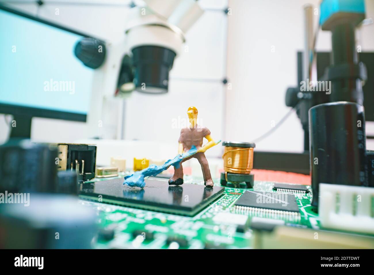 Miniature repair man on mainboard, Miniature figure of worker team try ...