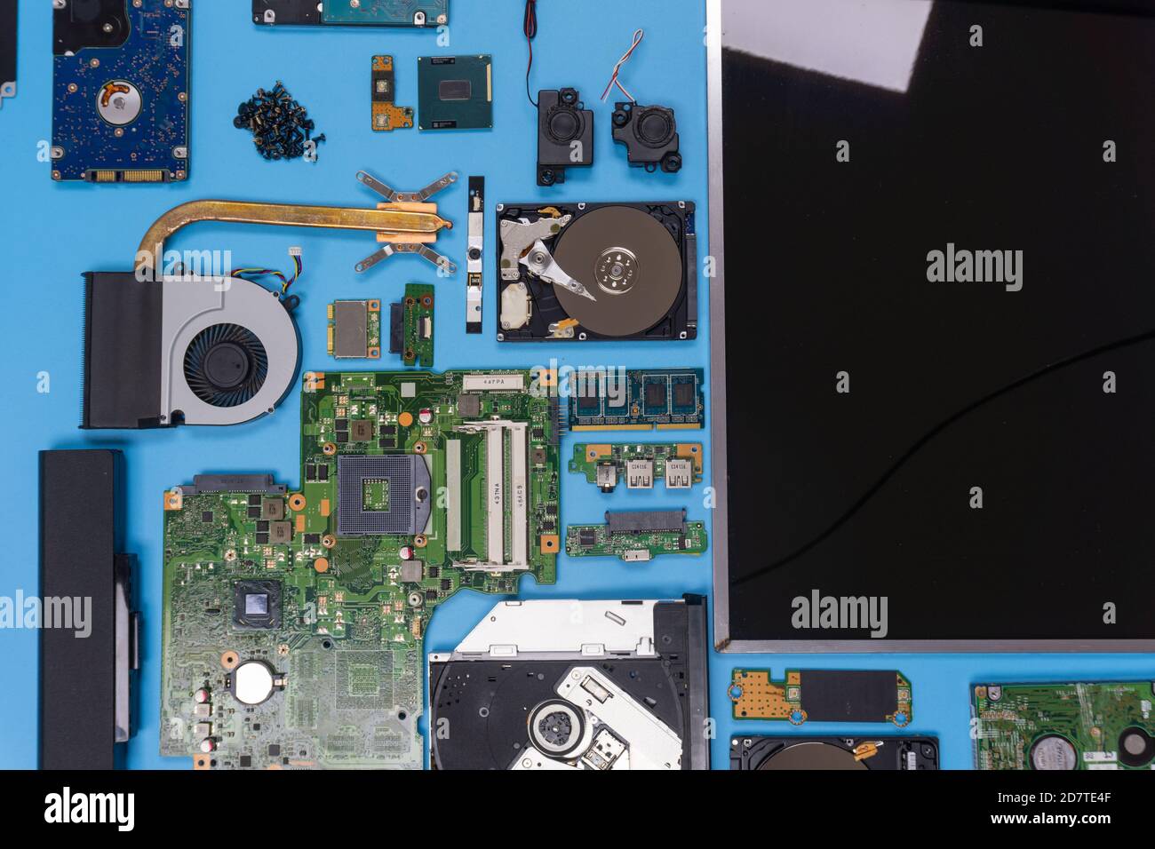 Parts of a modern computer. The insides of a laptop on a blue ...
