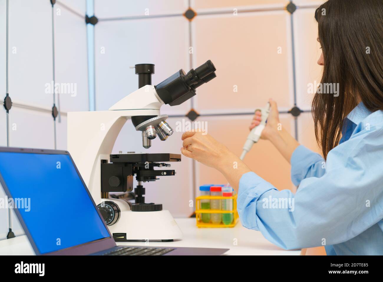 Young woman in a science lab. Health care researchers working in life ...