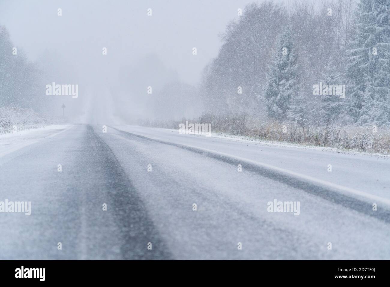 Asphalt road through snow hi-res stock photography and images - Alamy