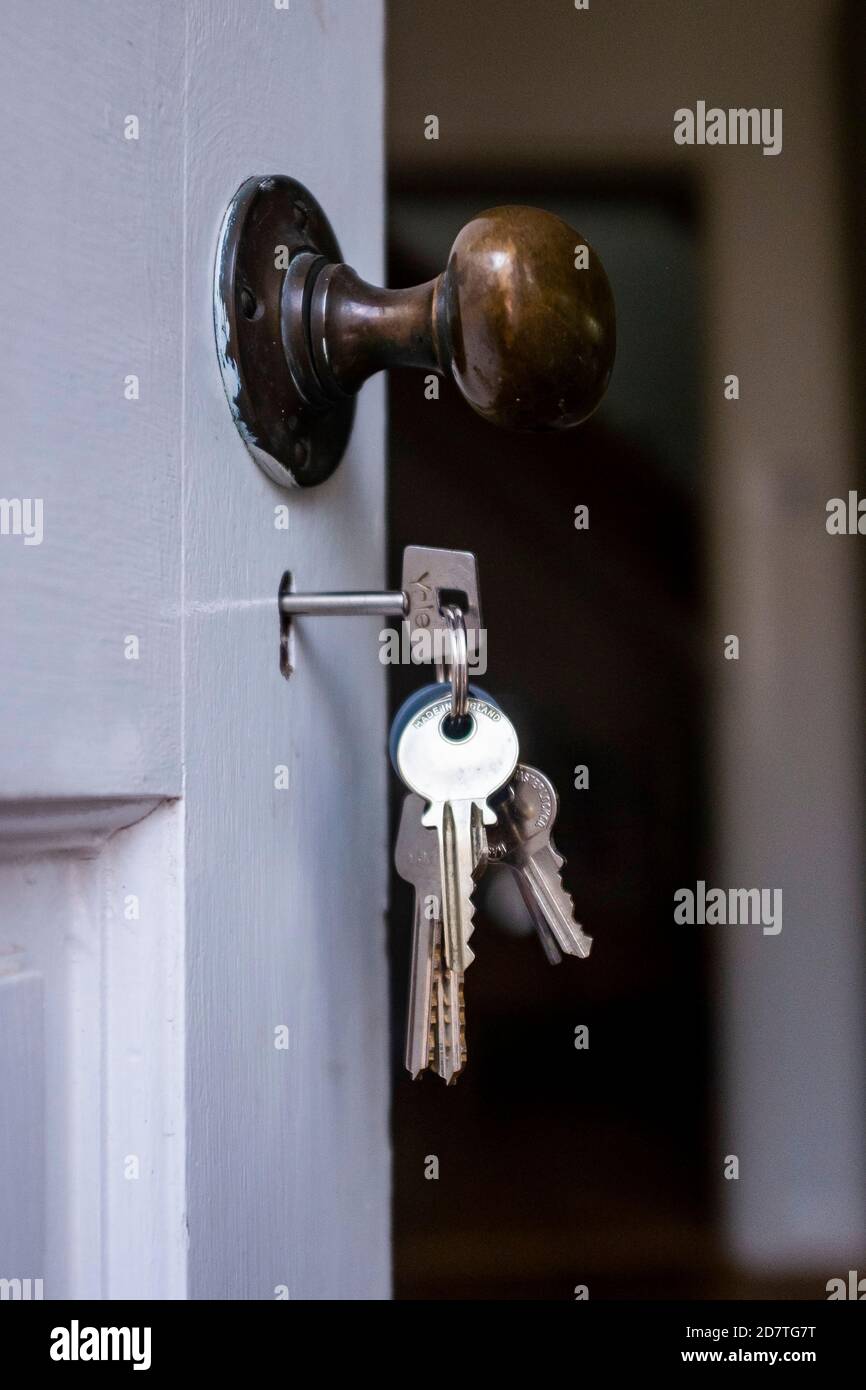Household keys in a door UK Stock Photo - Alamy