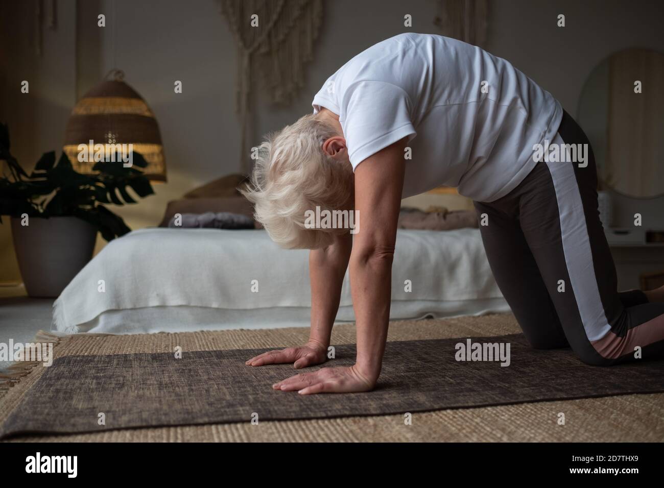 Woman doing spine exercise work hi-res stock photography and images - Alamy