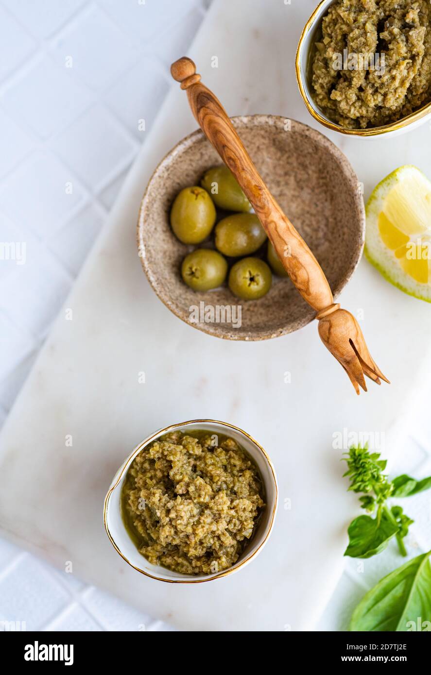 Top view of a green olive Tapenade on white background Stock Photo - Alamy