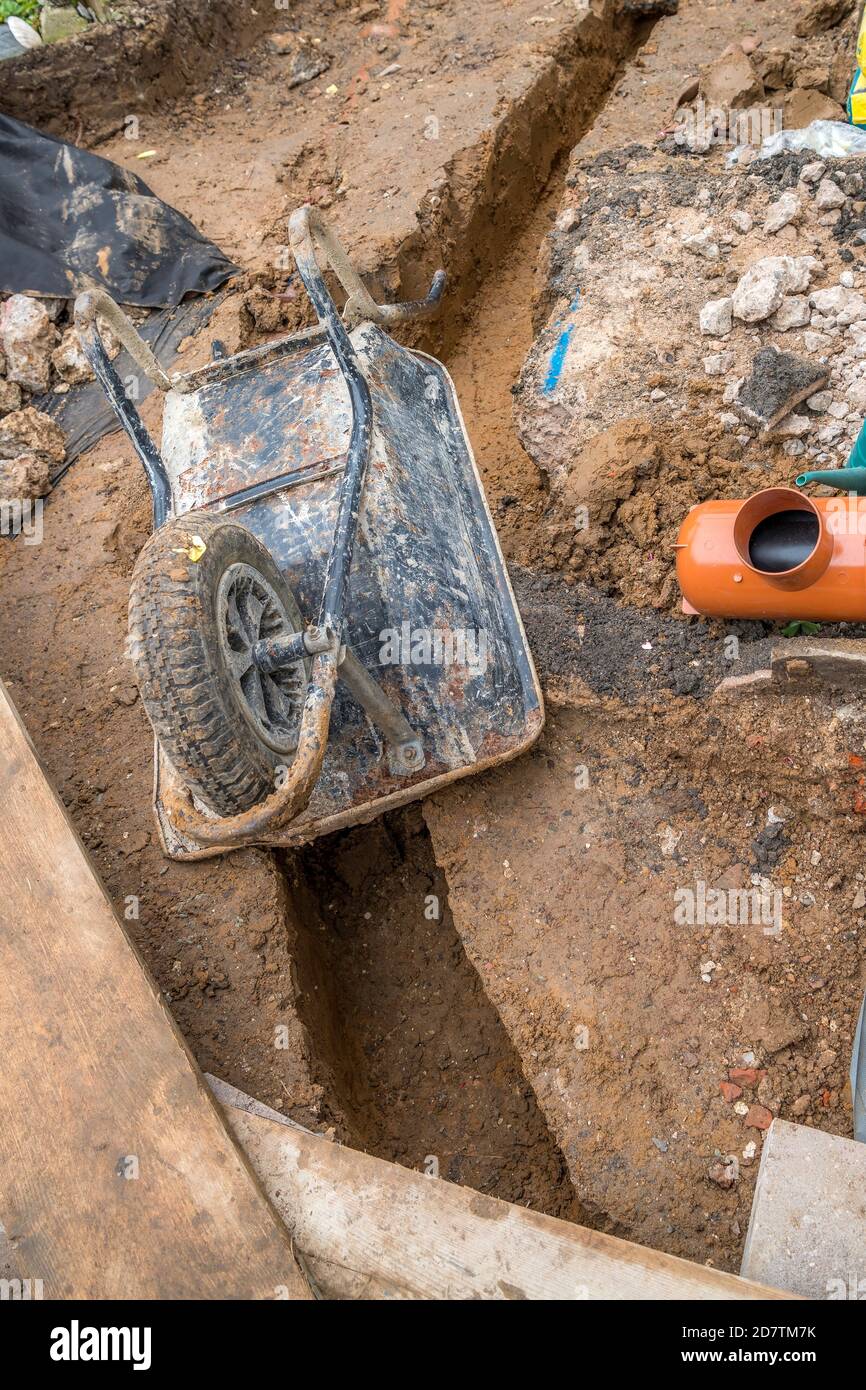 Wheel borrow at building site Stock Photo - Alamy