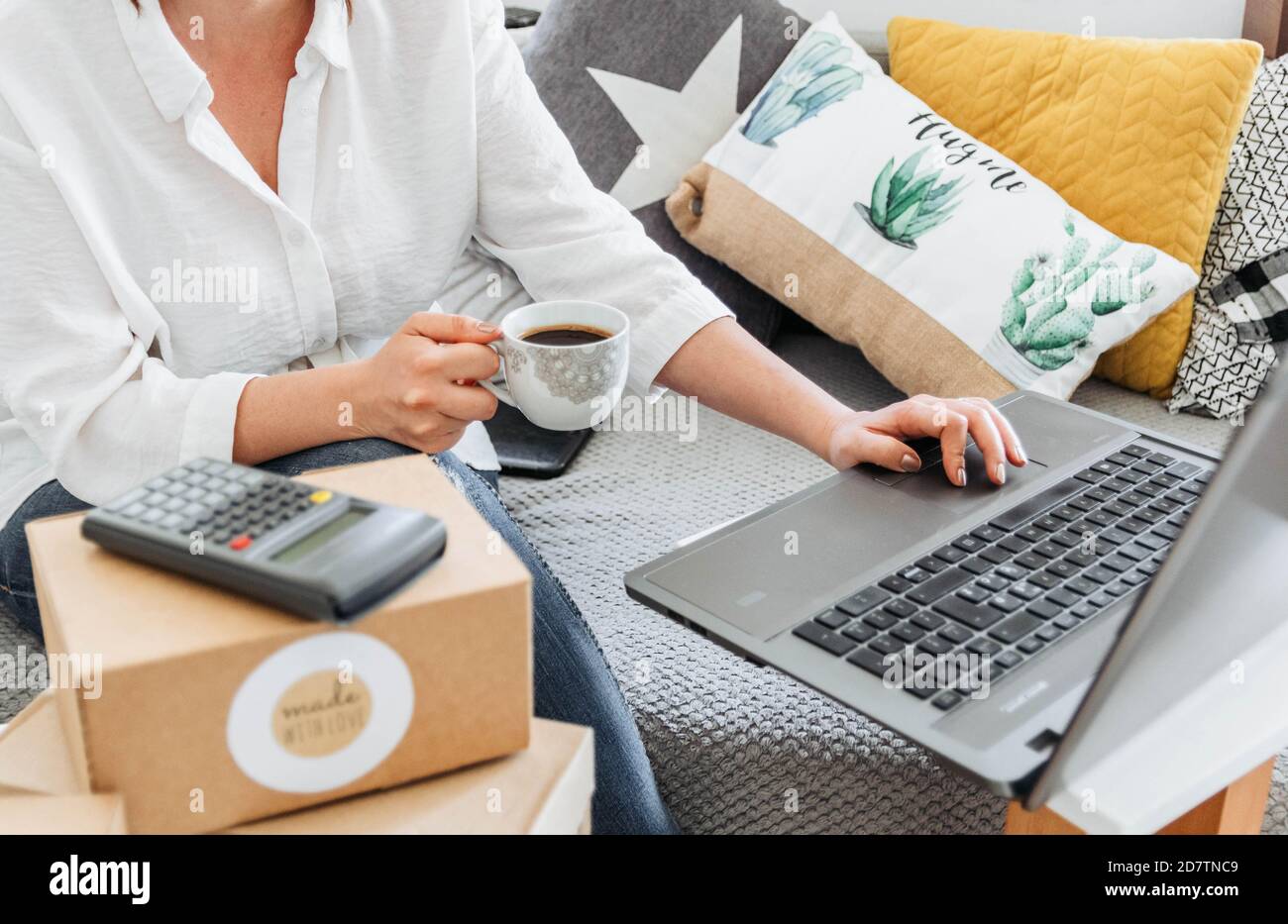 Female looking through the customers registered on her laptop to see ...
