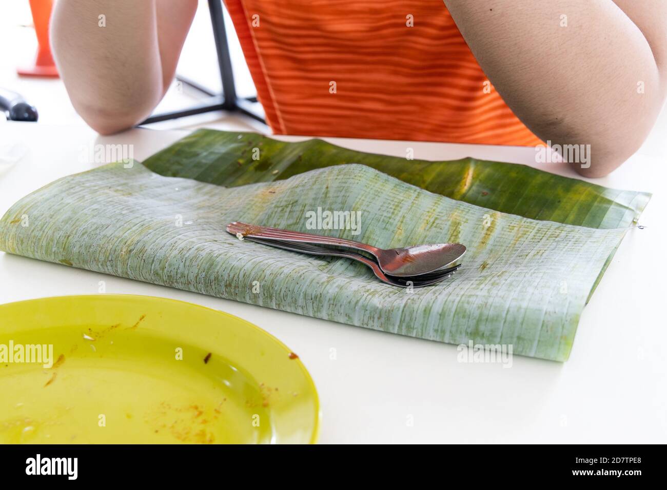 Upper Half Of Banana Leaf Folded Towards The Lower Half After Meal To Indicate Good Food Part upper-half-of-banana-leaf-folded-towards-the-lower-half-after-meal-to-indicate-good-food-part