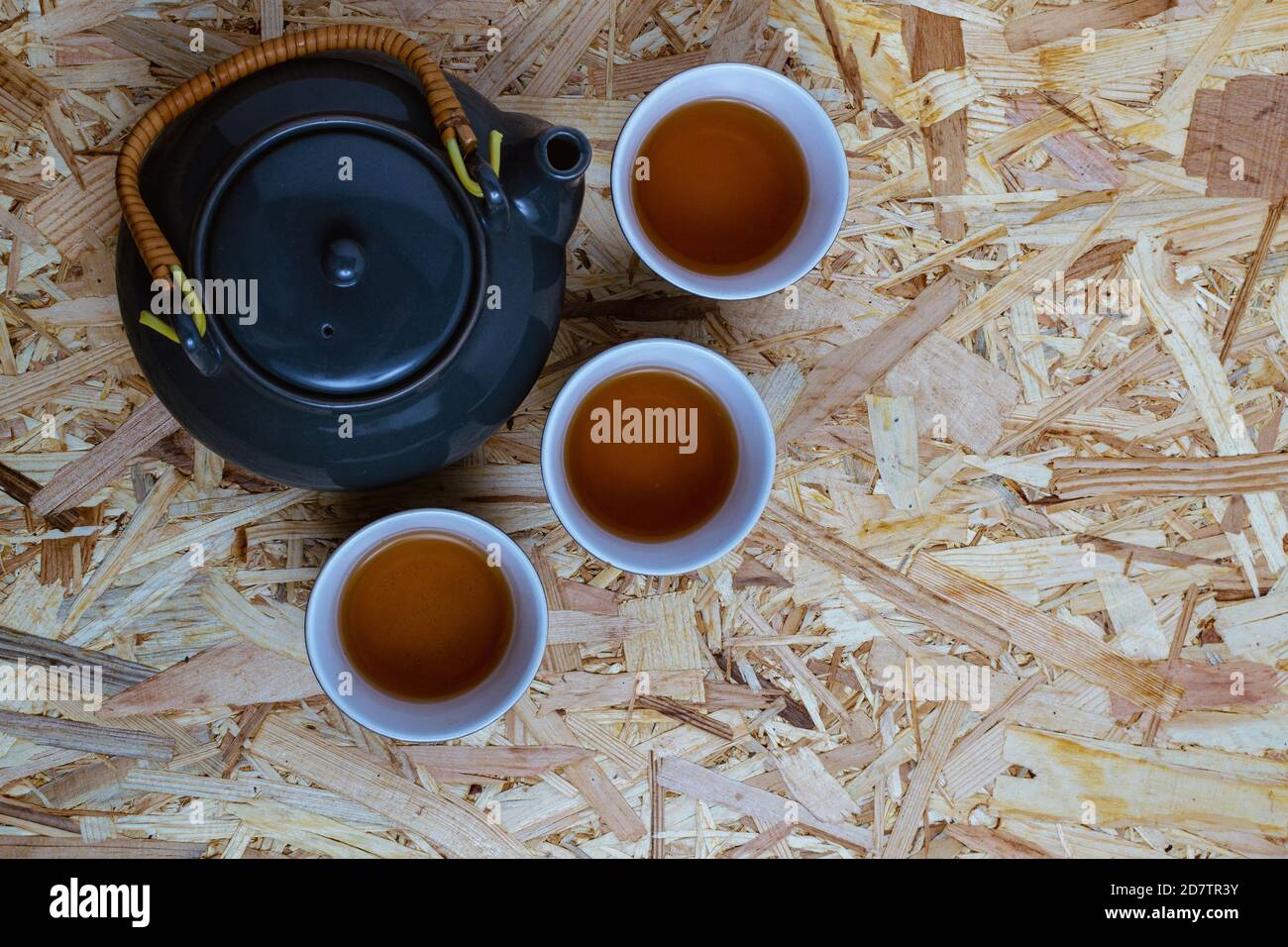 Top view of gray tea set on a pressed wooden panel surface Stock Photo ...