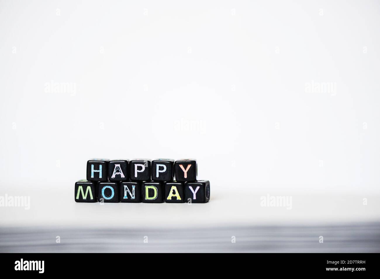 Happy Monday inscription of blocks on white page open notebook on ...