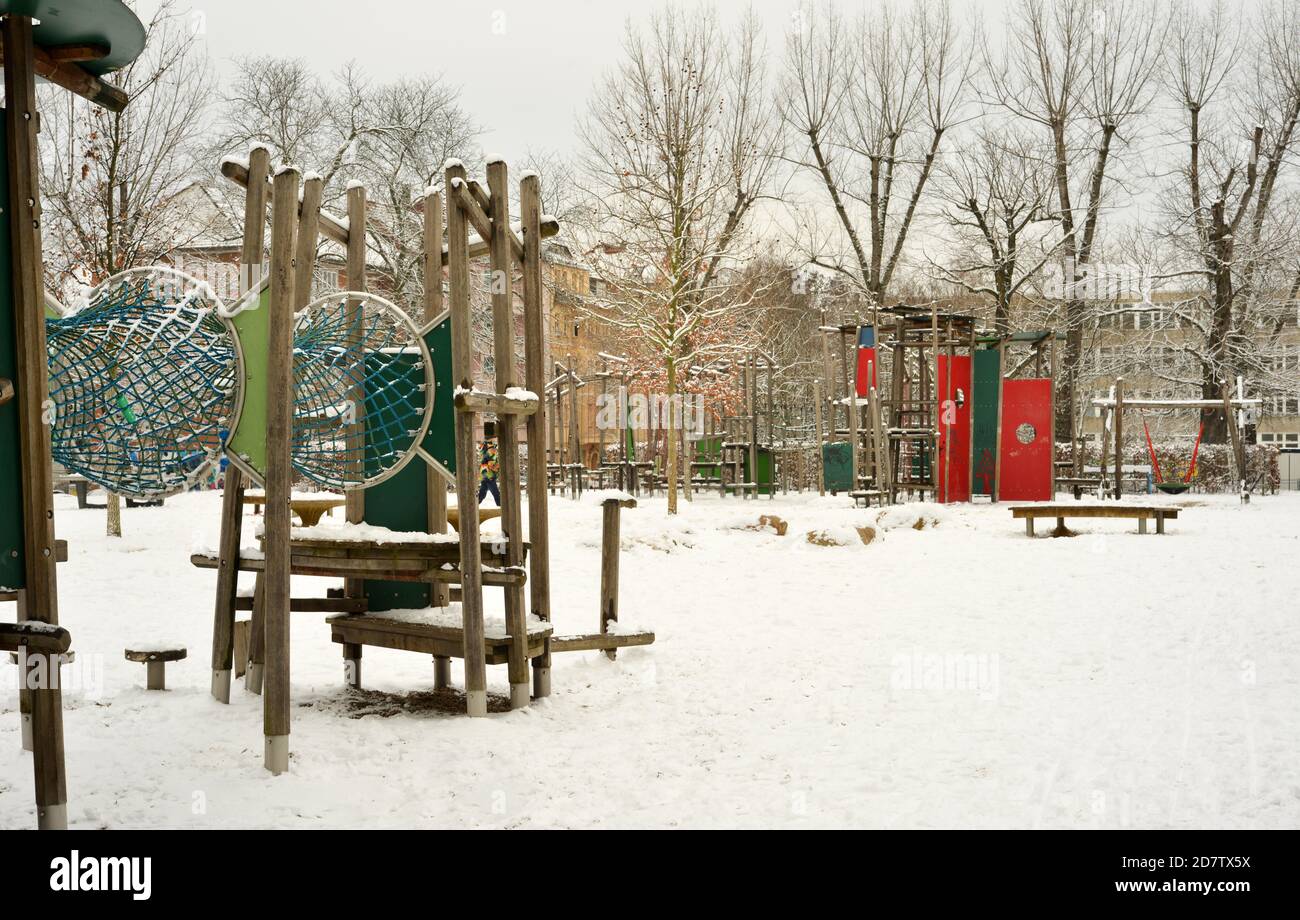Kids playground in winter season, covered with snow Stock Photo - Alamy