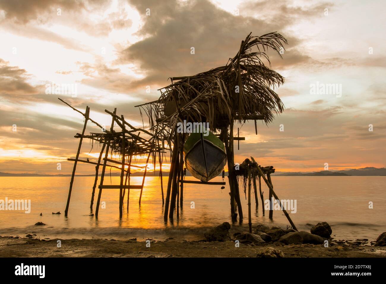 A ship with a beautiful sunset background in south Halmahera, North ...