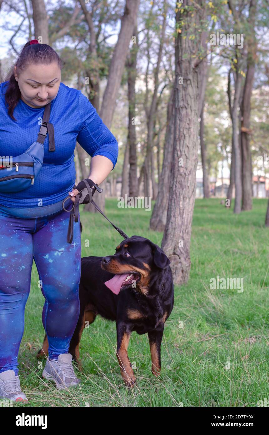 Part 1 of 5. Exterior stance training for Rottweiler dog. Adult woman ...