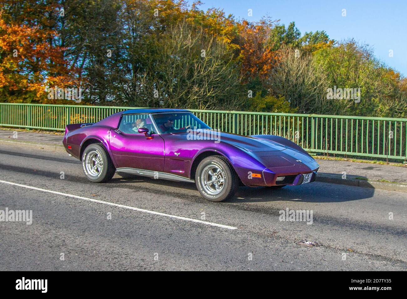 1976 70s mauve purple Chevrolet GMC Corvette; Vehicular traffic, moving ...