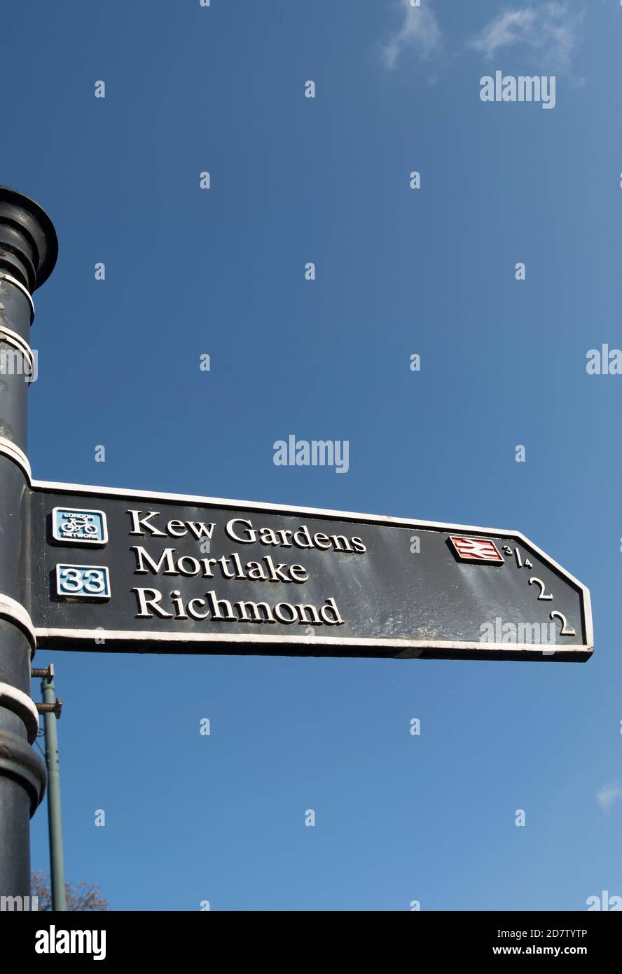 right pointing sign giving directions for kew gardens, mortlake and ...