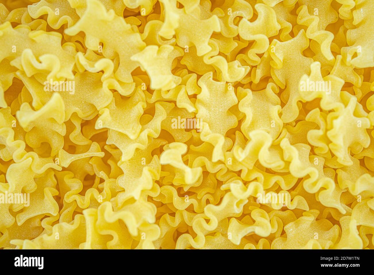 Italian dry wavy pasta background. Healthy traditional food. Top view ...