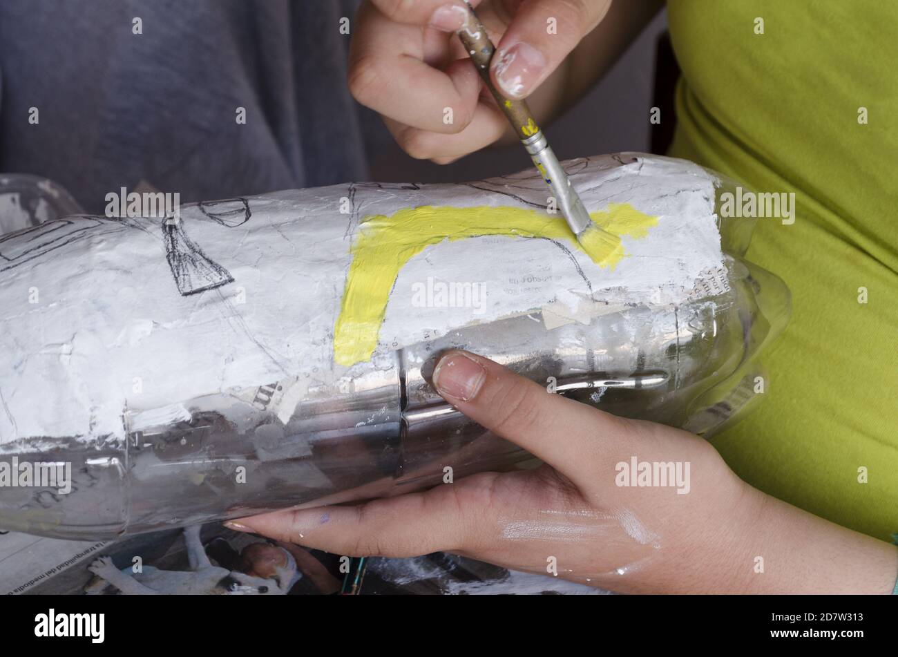 Person painting with acrylic paint a paper mask Stock Photo - Alamy