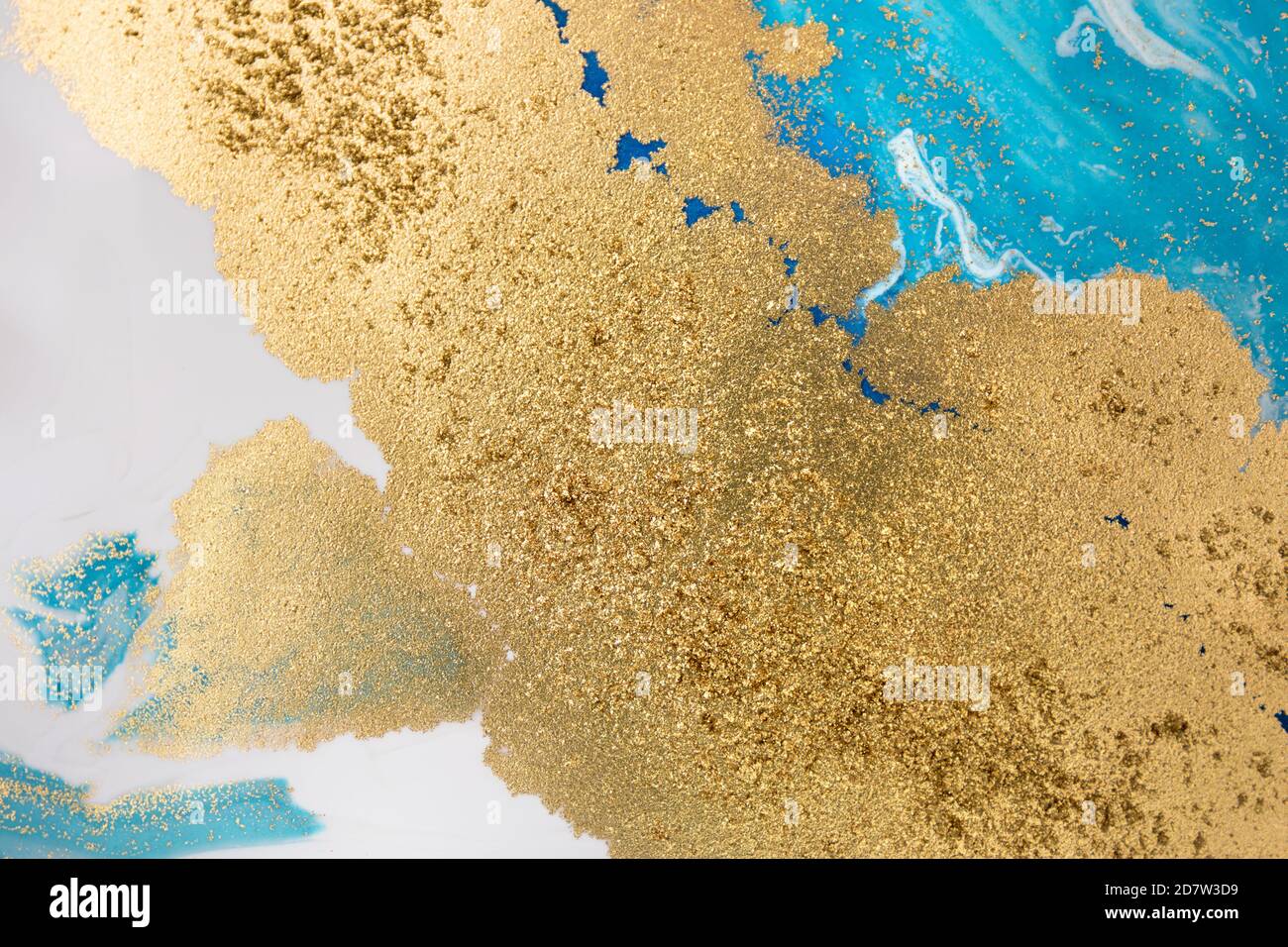 Piles of gold sequins on blue smudges of paint. Abstract pattern Stock ...