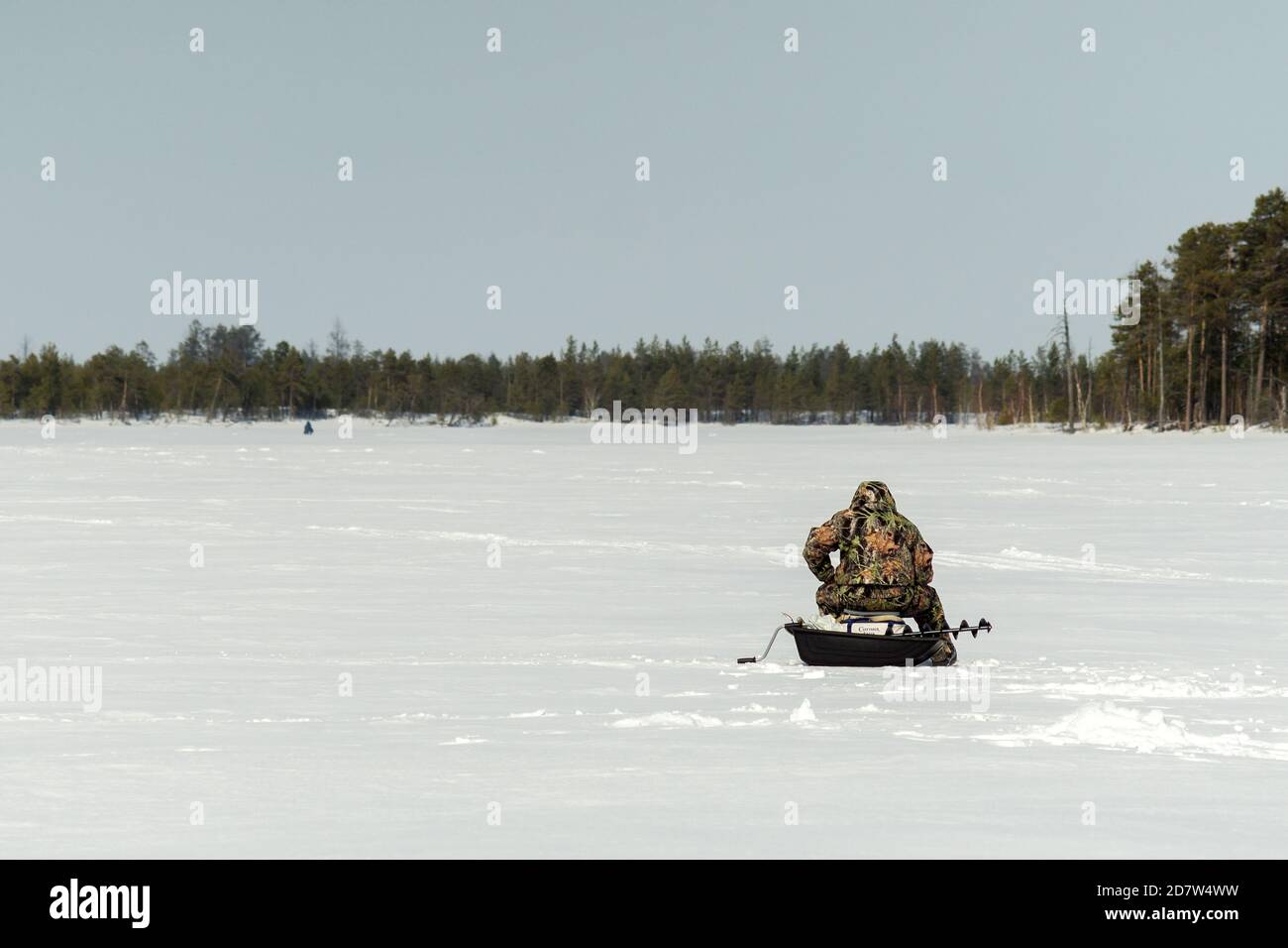 winter fishing a fisherman catches fish in winter. winter sport Stock ...