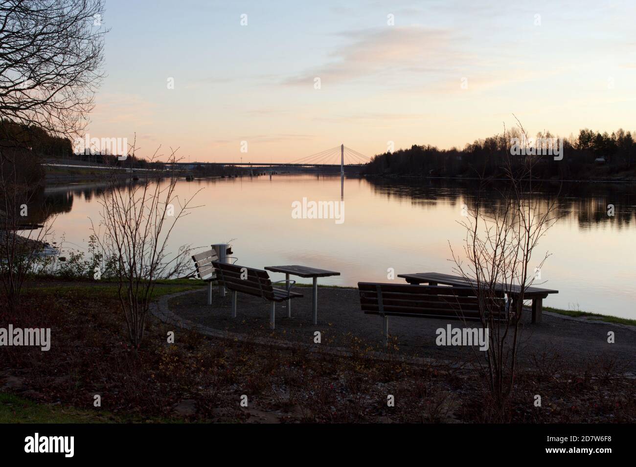 View from a boardwalk by a river. Late evening lit in the autumn, fall ...
