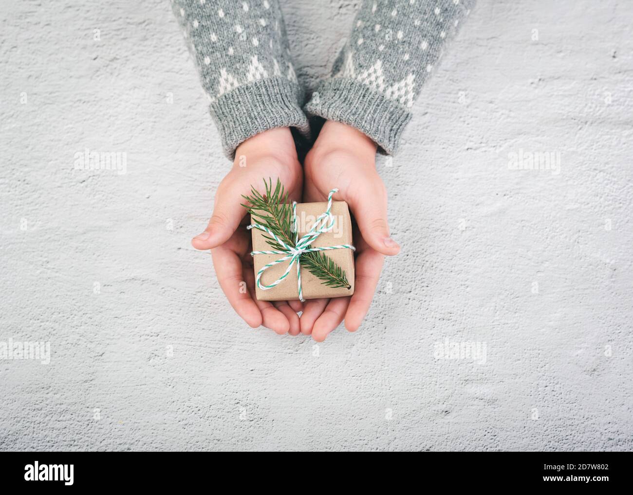 Merry Christmas.Child hands holding a Christmas present.Christmas ...