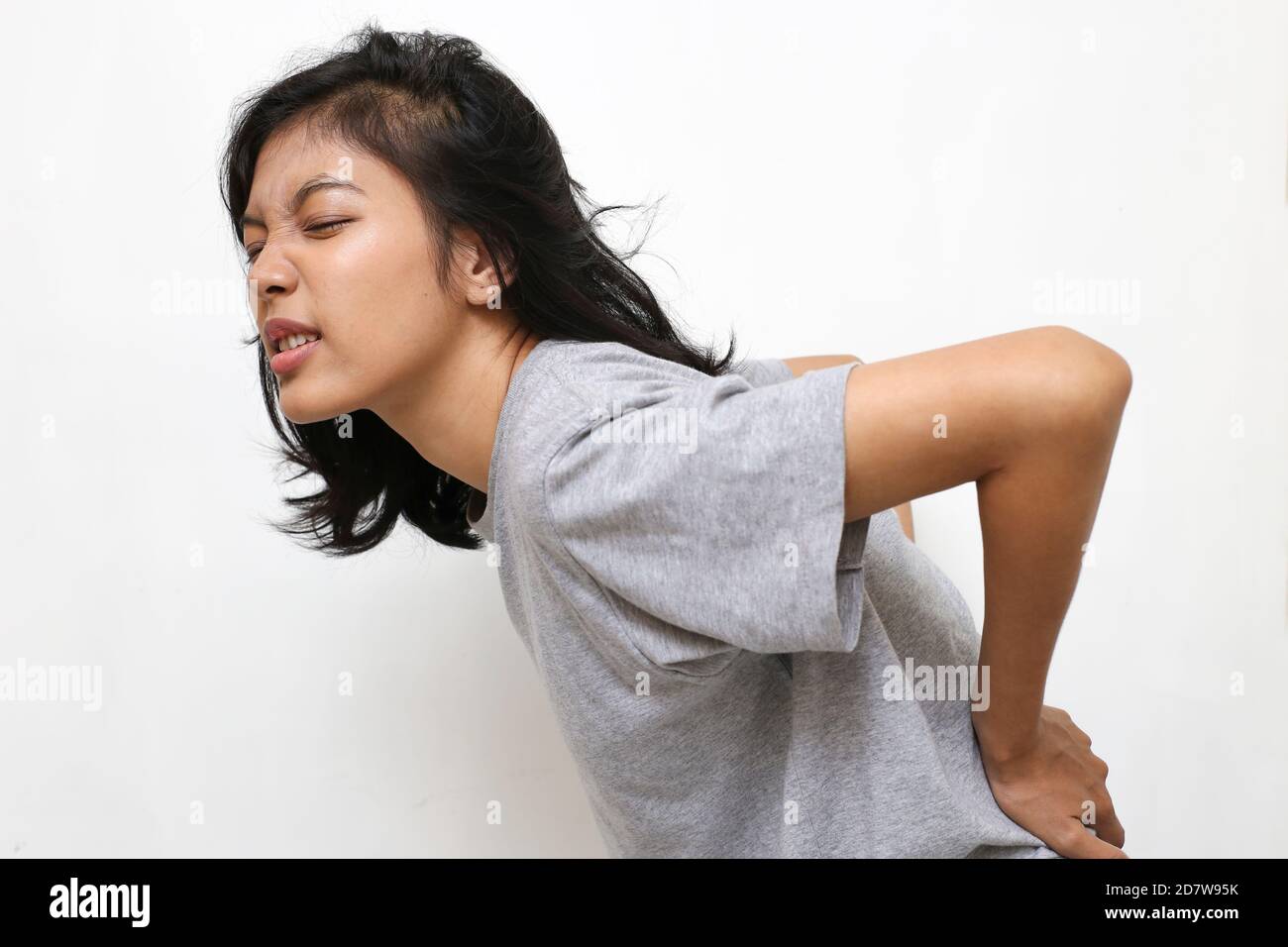 Young asian woman suffering low back pain and waist lumbar pain Stock ...