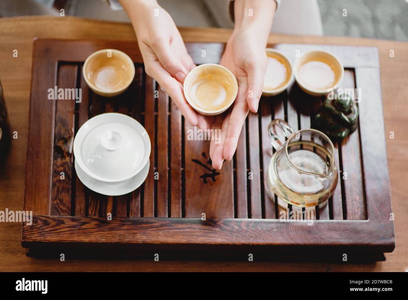 Hands with teapot hi-res stock photography and images - Alamy