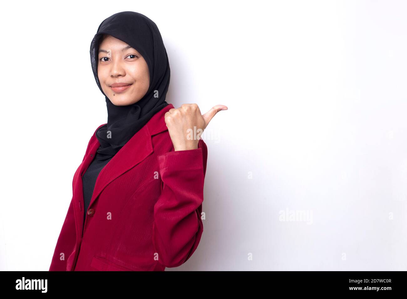 Young asian business woman fist wearing hijab on white background smiling confident . Copy space ...