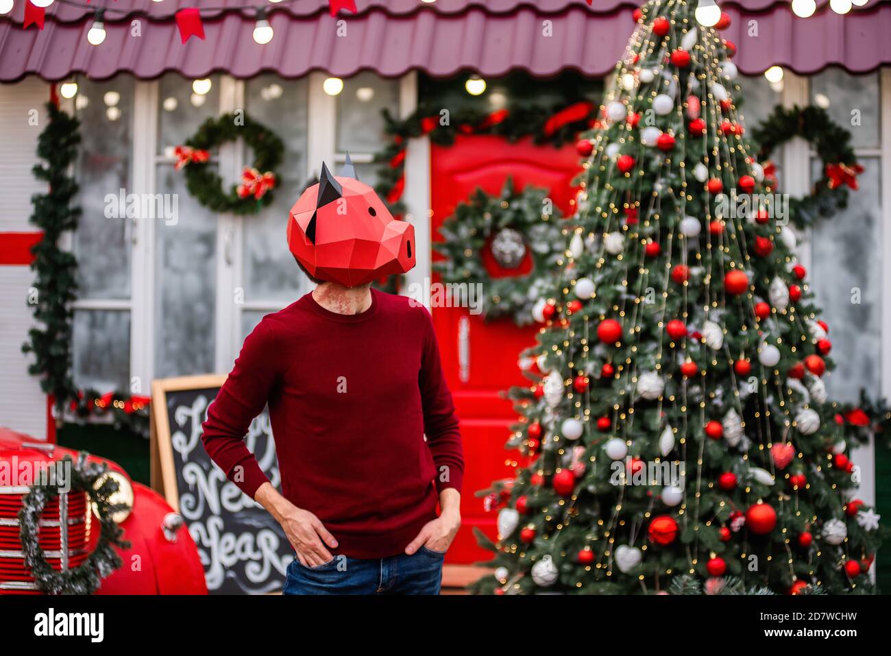 A young man in a bull ox costume is a symbol of the new year against ...