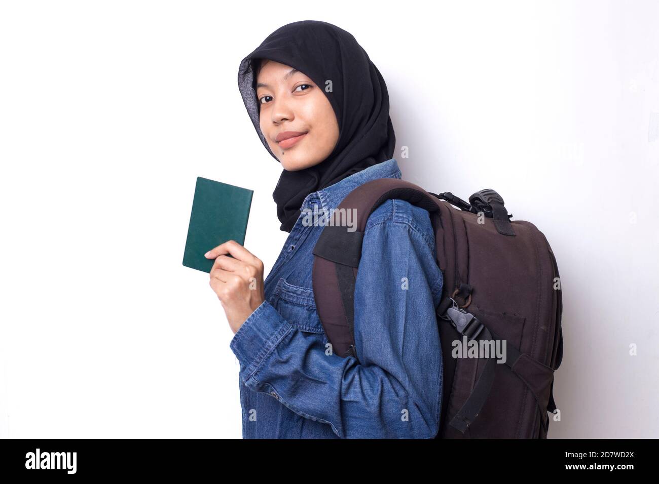 Asian muslim woman hijab backpacker holding passport isolated on white ...
