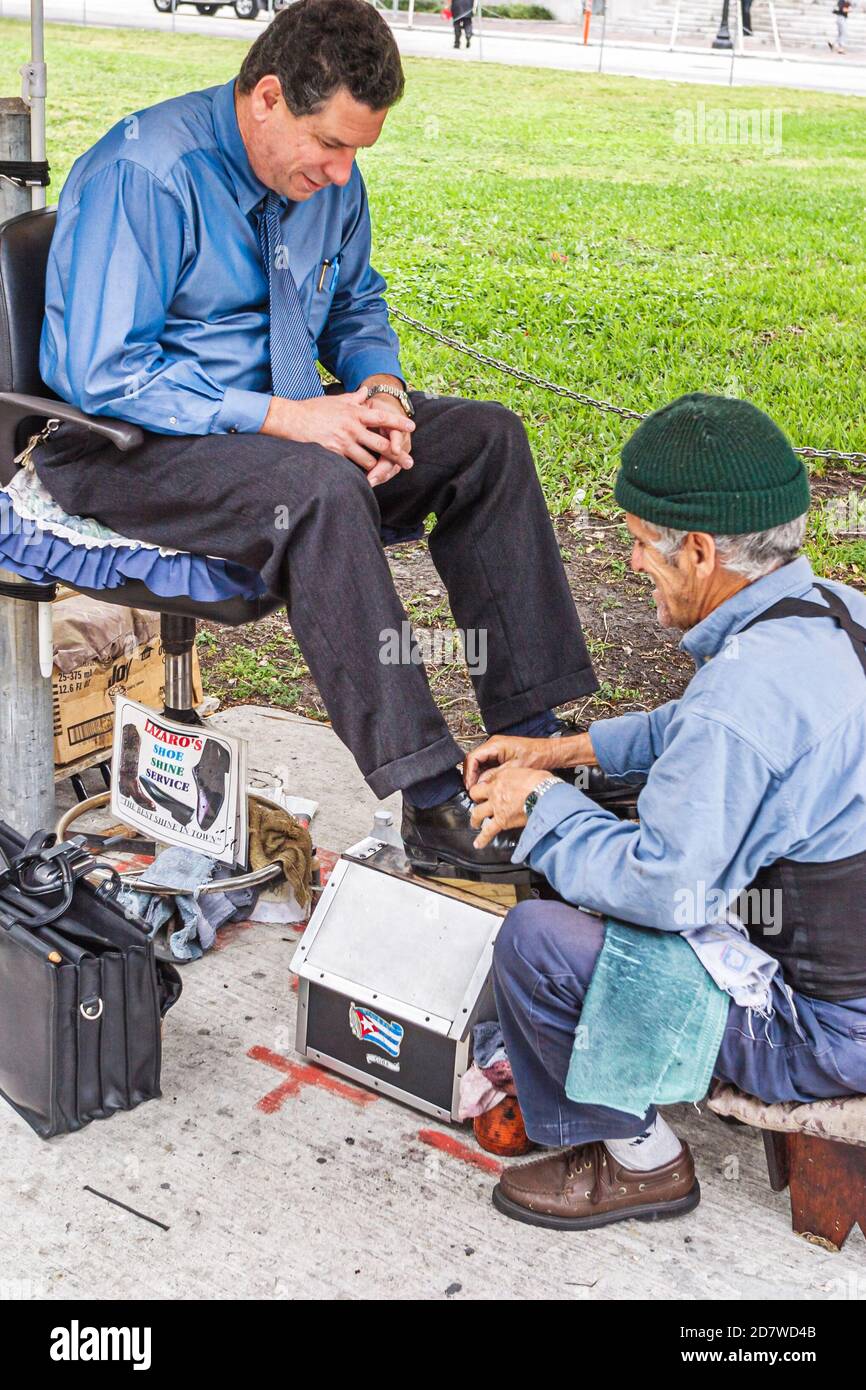 Miami Florida,Flagler Street Hispanic man,sidewalk shoeshine working ...
