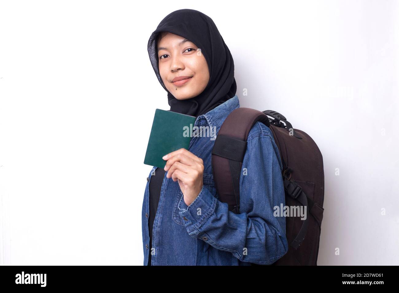 Asian muslim woman hijab backpacker holding passport isolated on white ...
