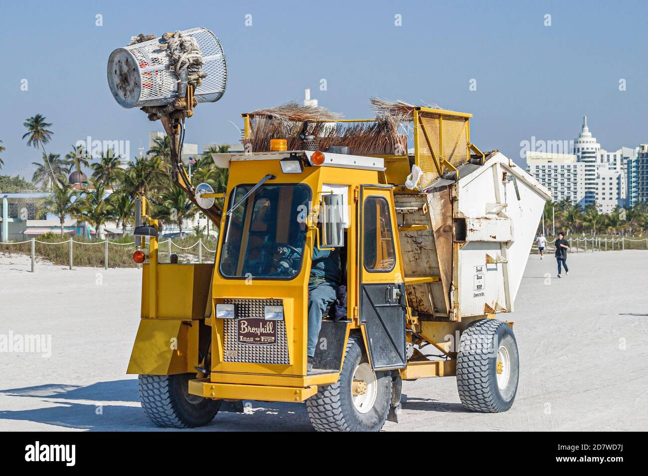 Miami Beach Florida,public seashore,city vehicle mechanically empties ...